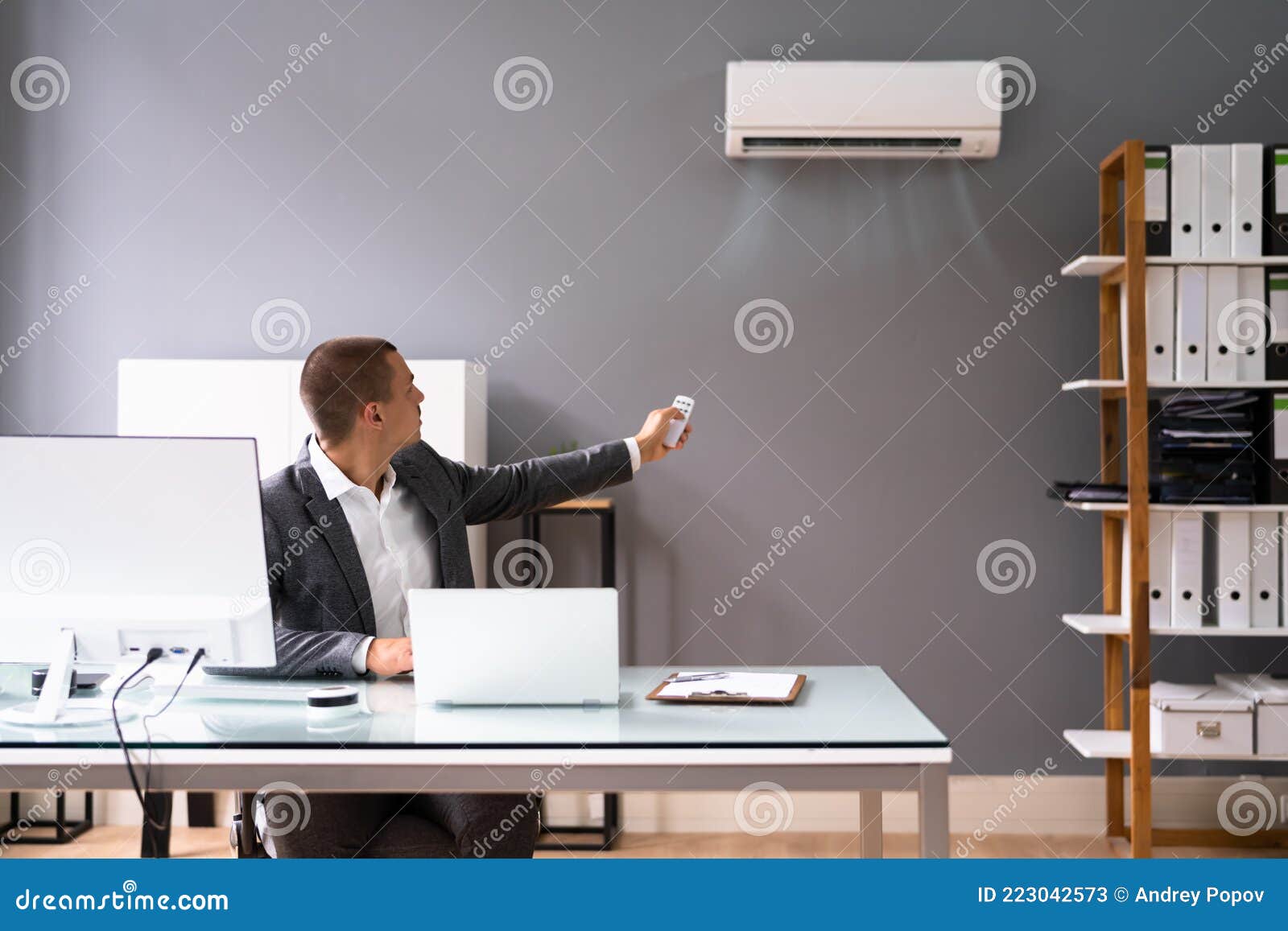 Businessman in Office Using Air Conditioning Stock Image - Image of ...