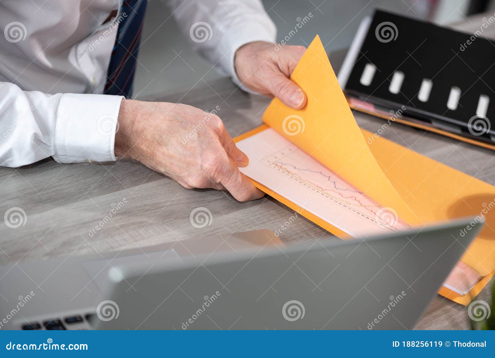 Businessman opening folder stock image. Image of worker - 188256119