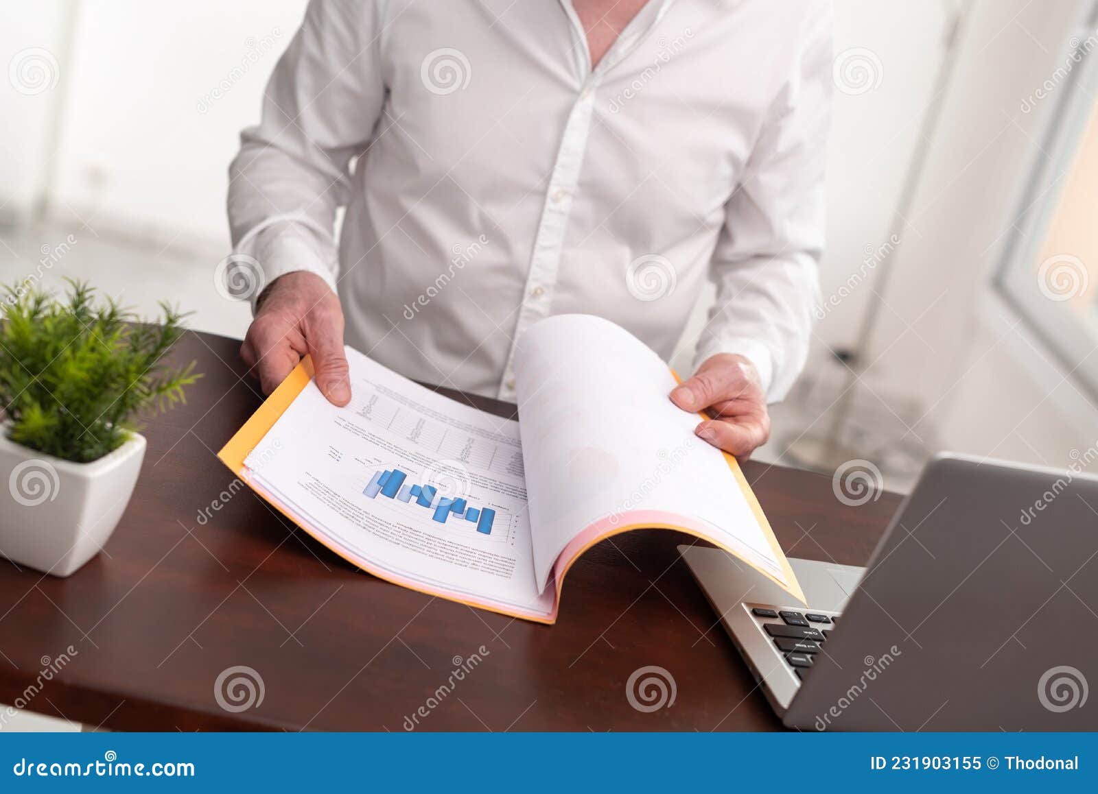 Businessman opening folder stock image. Image of office - 231903155