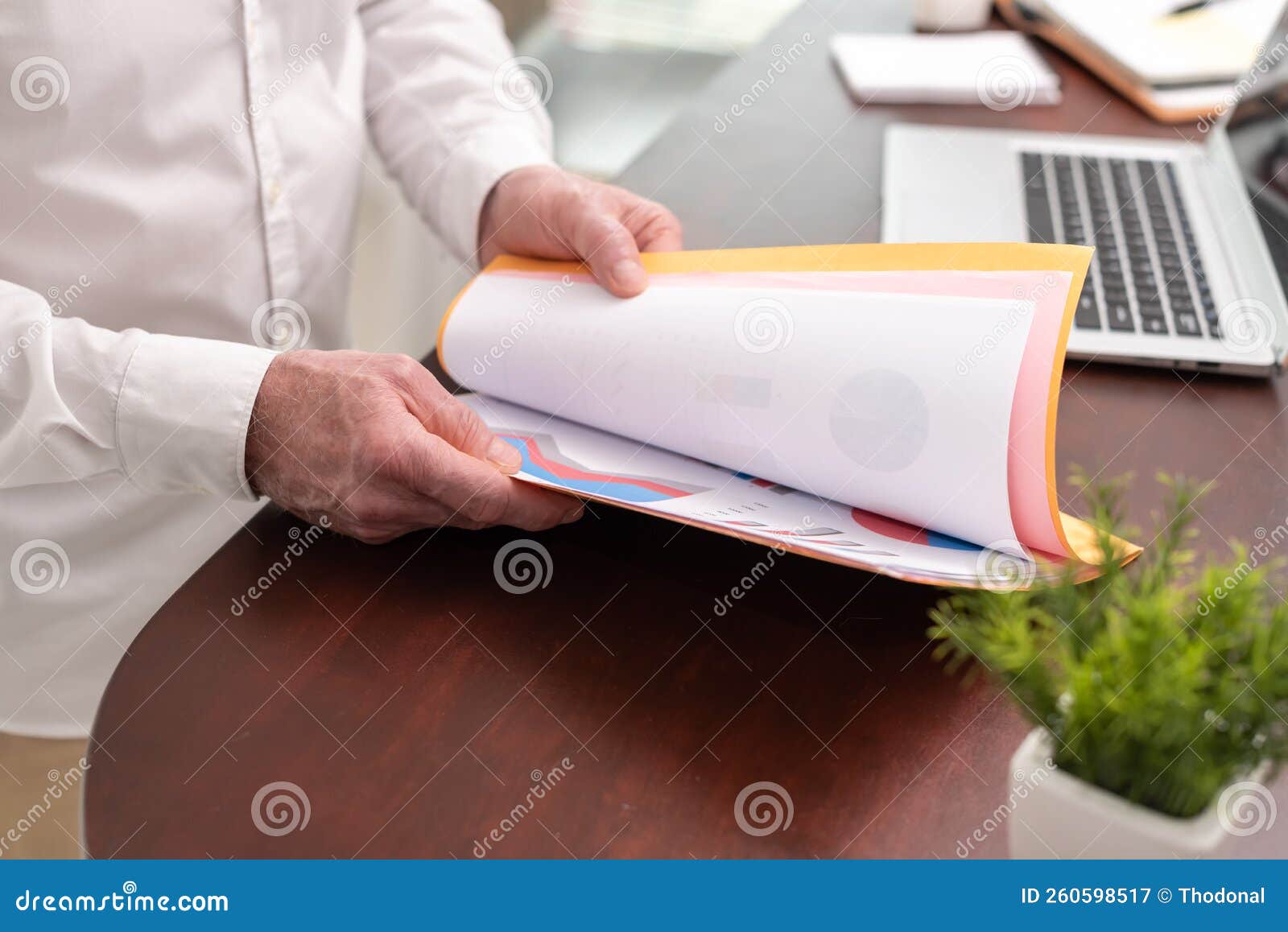 Businessman opening folder stock image. Image of report - 260598517
