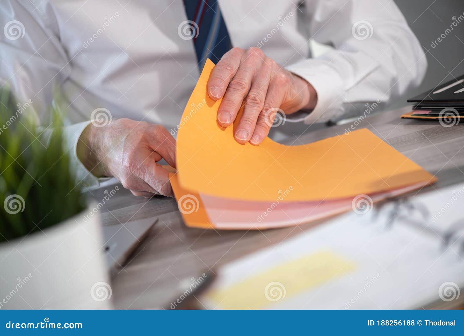 Businessman opening folder stock photo. Image of working - 188256188