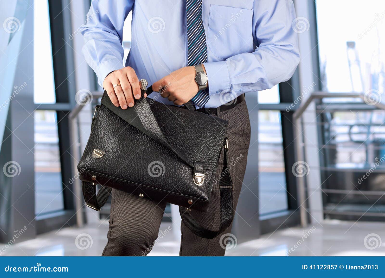 Businessman Opening a Leather Briefcase Stock Image - Image of holds ...