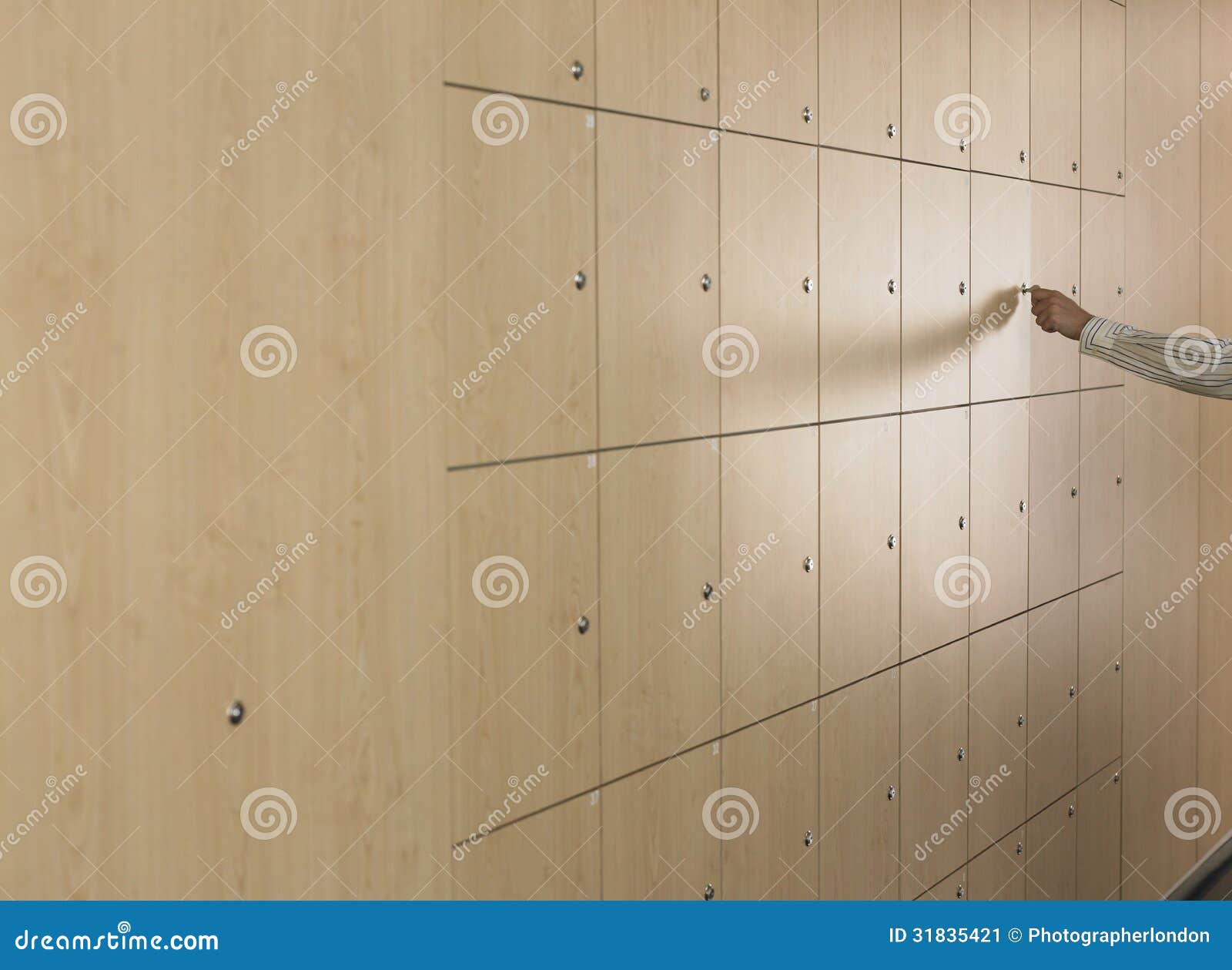 Businessman Opening Locker stock image. Image of indoors - 31835421