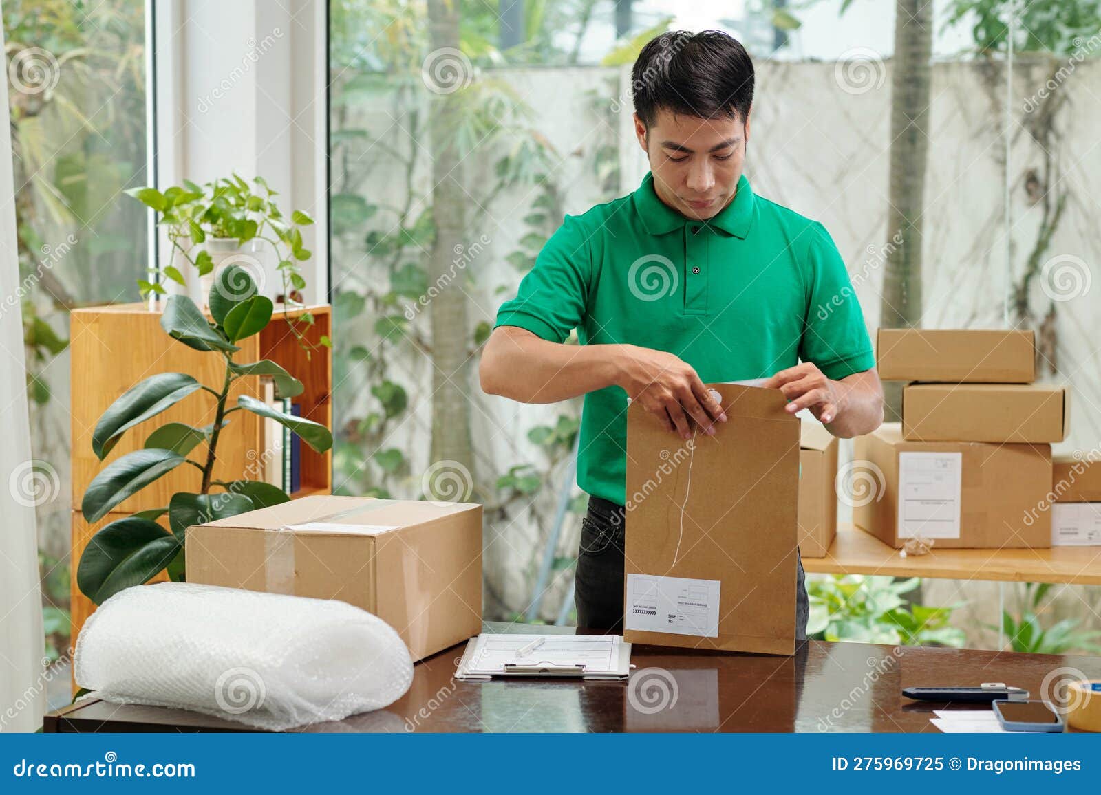 Businessman Packing Orders stock image. Image of tape - 275969725
