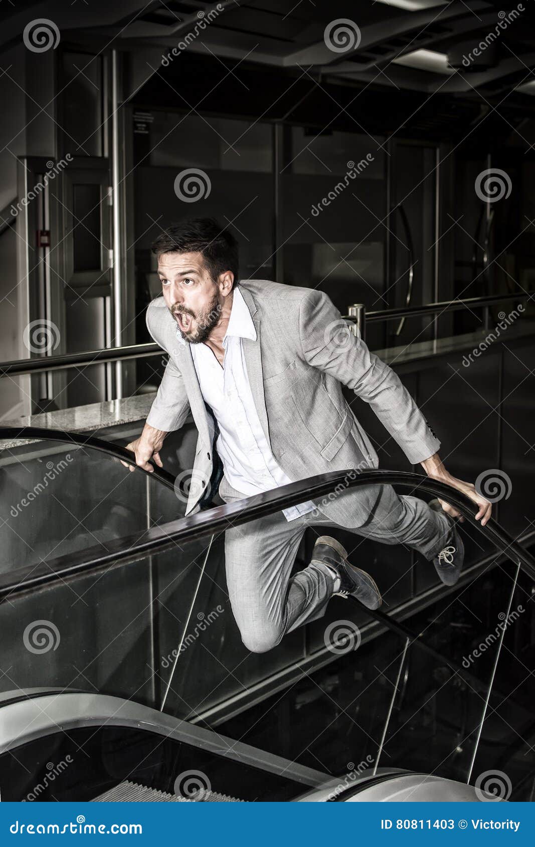 Businessman in Panic. Strong Young Man on Escalator. Stress Concept ...
