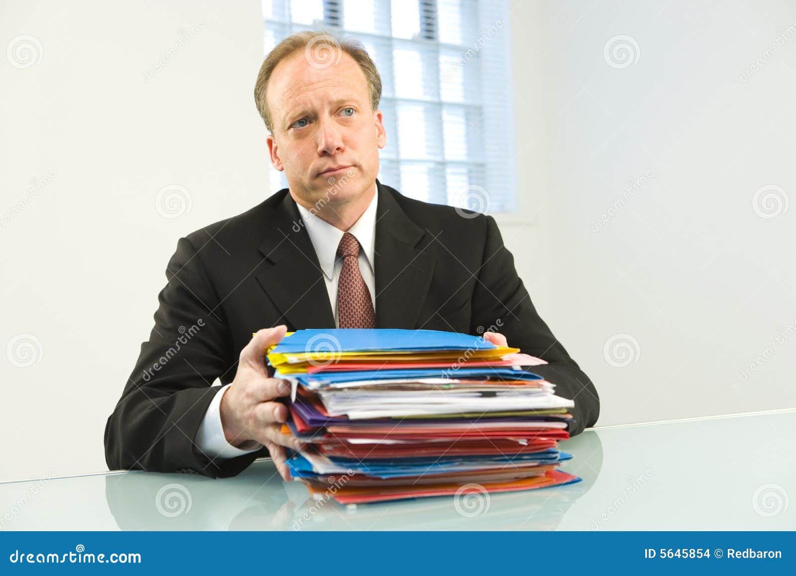 Businessman with paperwork stock photo. Image of files - 5645854