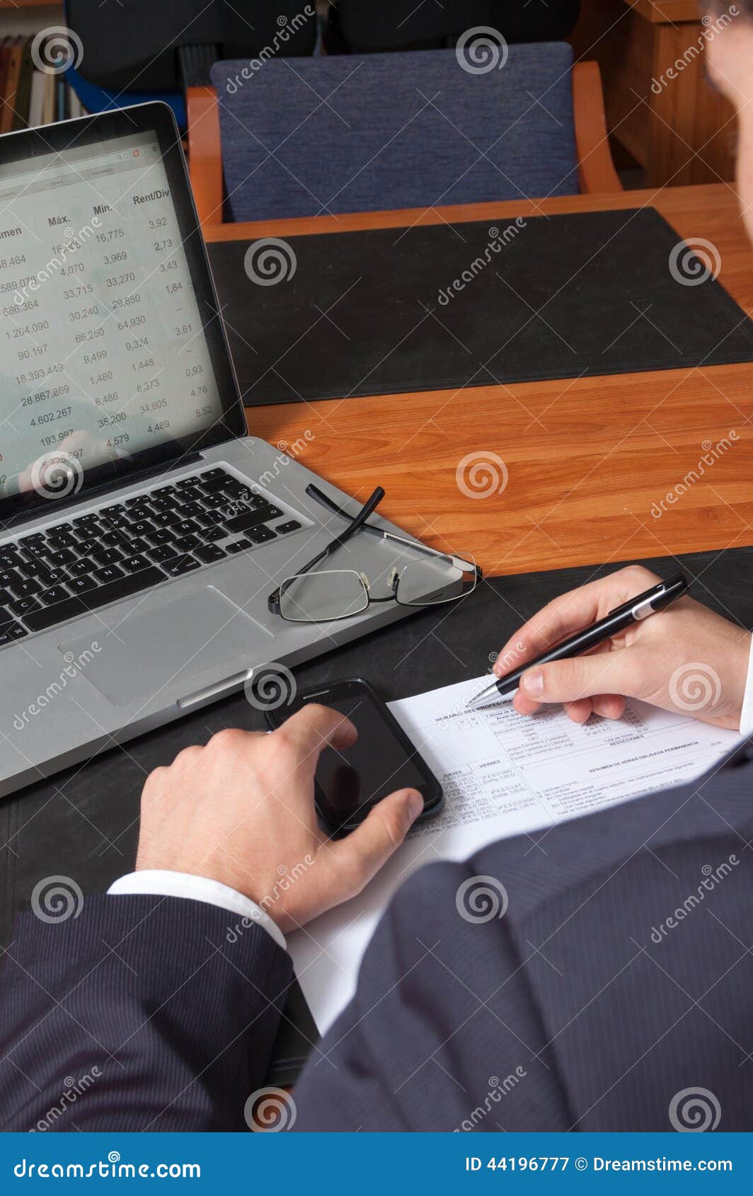 Businessman with Pen, Documents, Laptop and Smartphone Stock Image ...