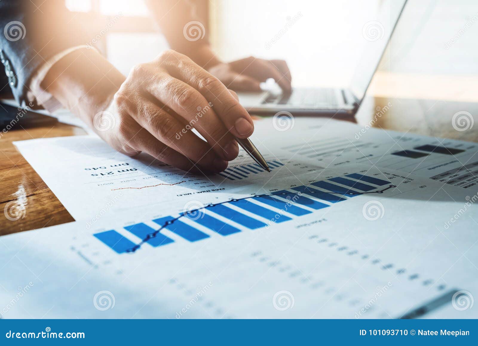 Businessman Pen Pointing Turnover with Graph Chart Report and Us Stock ...