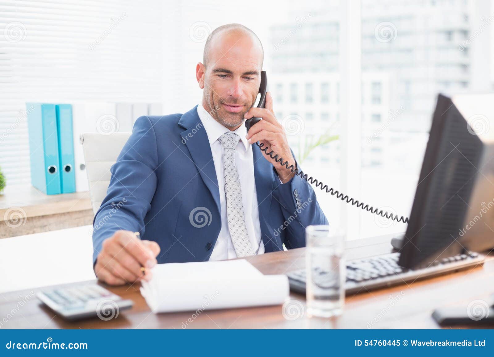 Businessman on the Phone and Writing Notes Stock Image - Image of ...