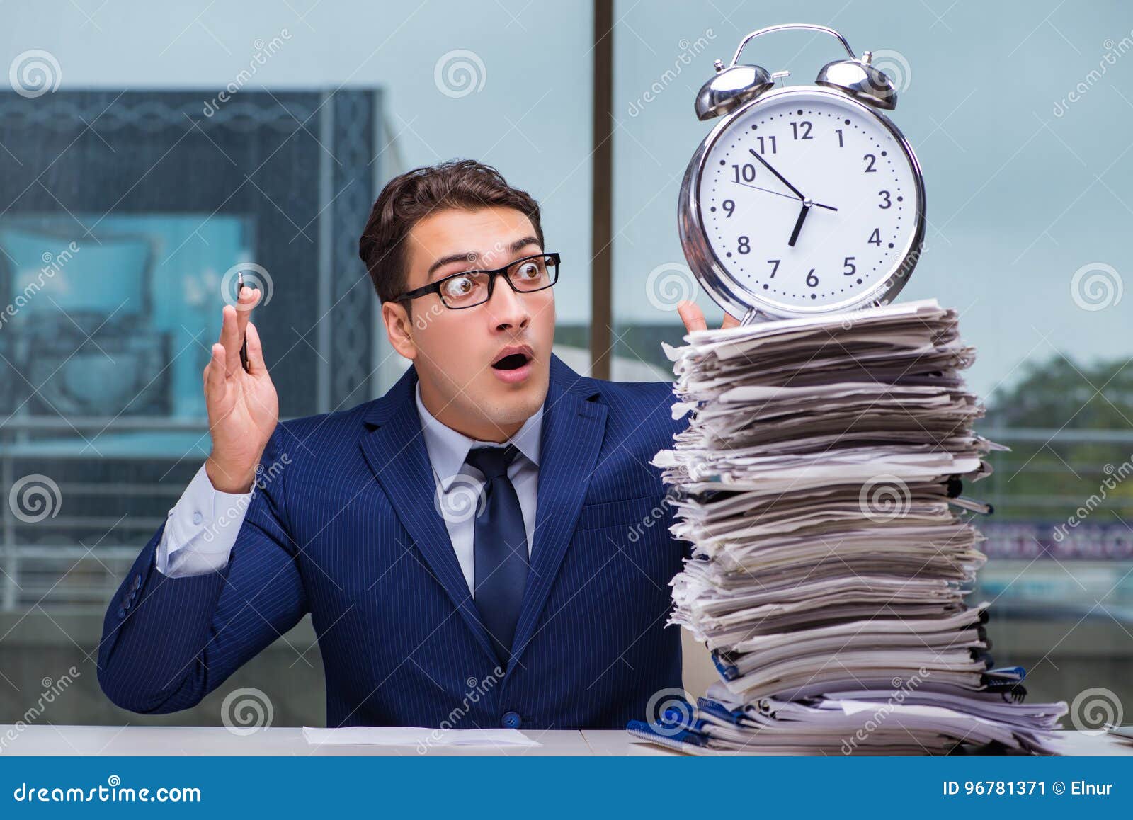 Businessman with Pile Stack of Paper Paperwork and an Alarm Cloc Stock ...