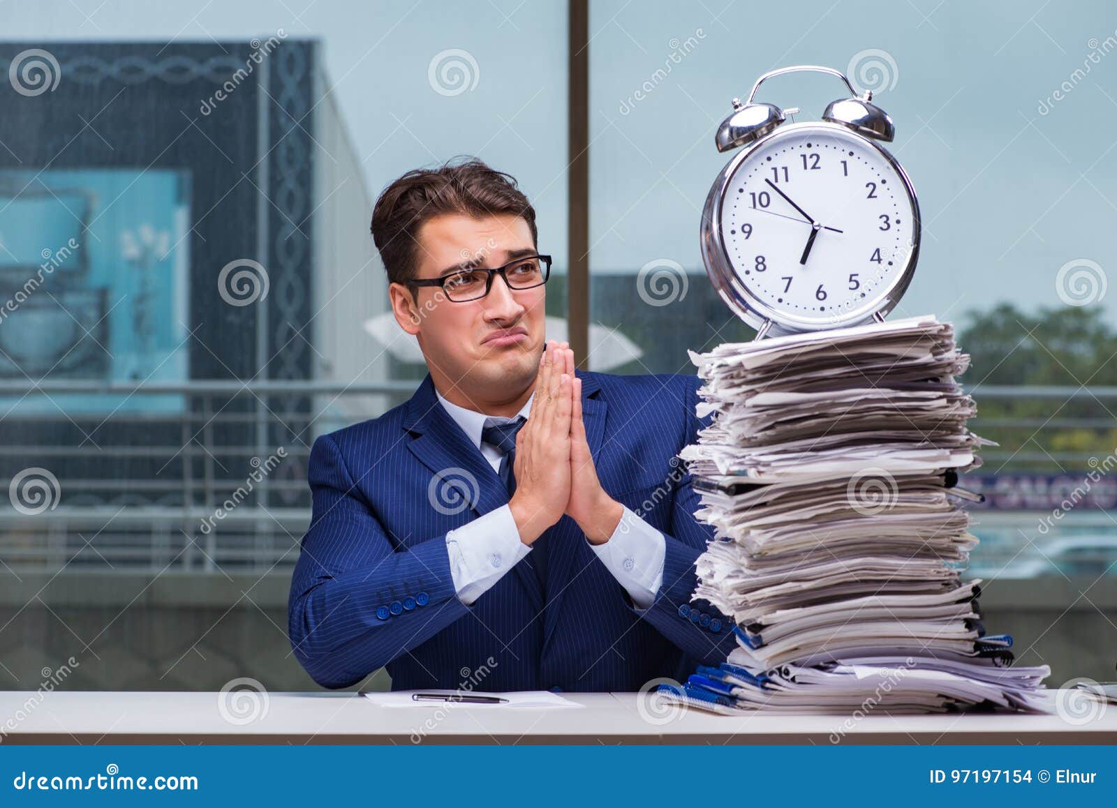 Businessman with Pile Stack of Paper Paperwork and an Alarm Cloc Stock ...