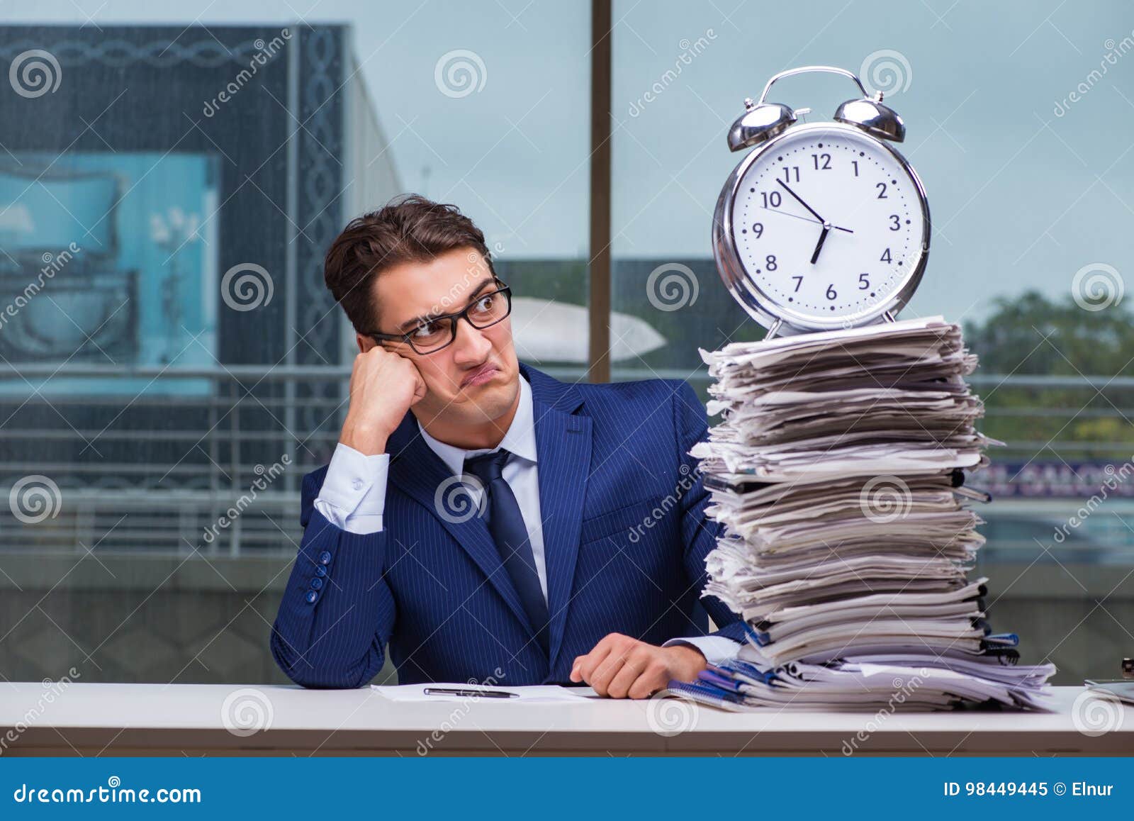 Businessman with Pile Stack of Paper Paperwork and an Alarm Cloc Stock ...