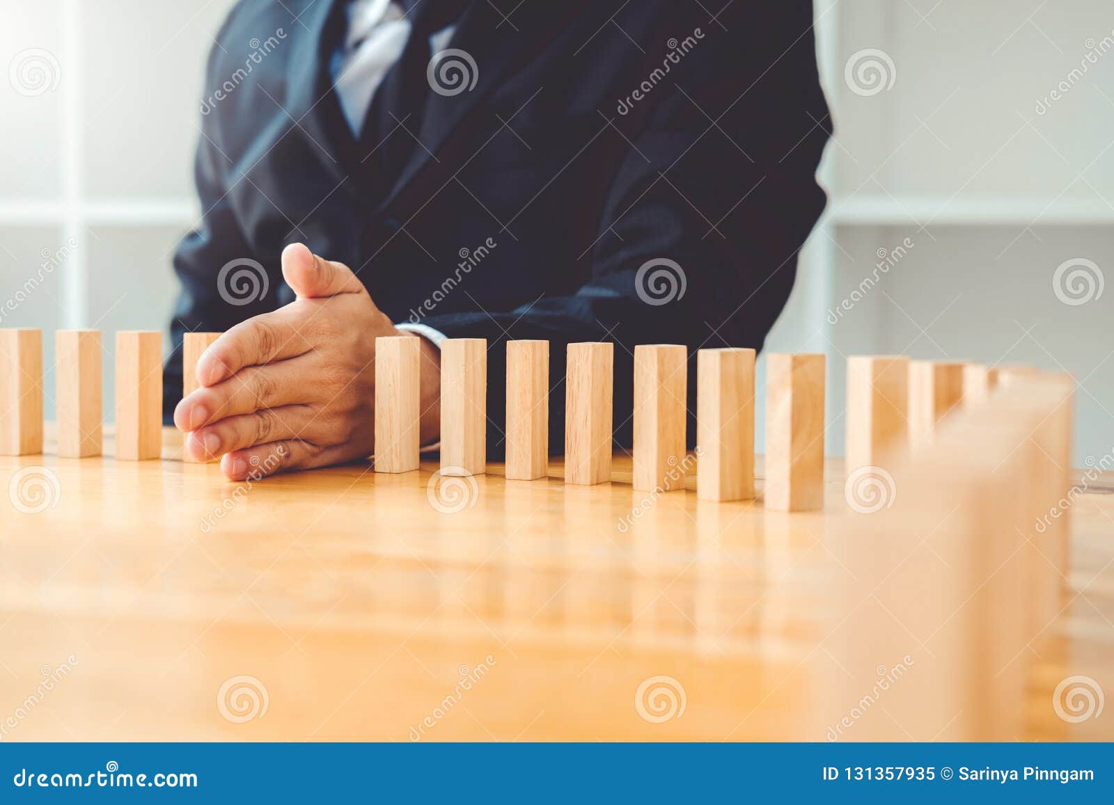Businessman Plan and Strategy in Business Domino Effect Problem Stock ...