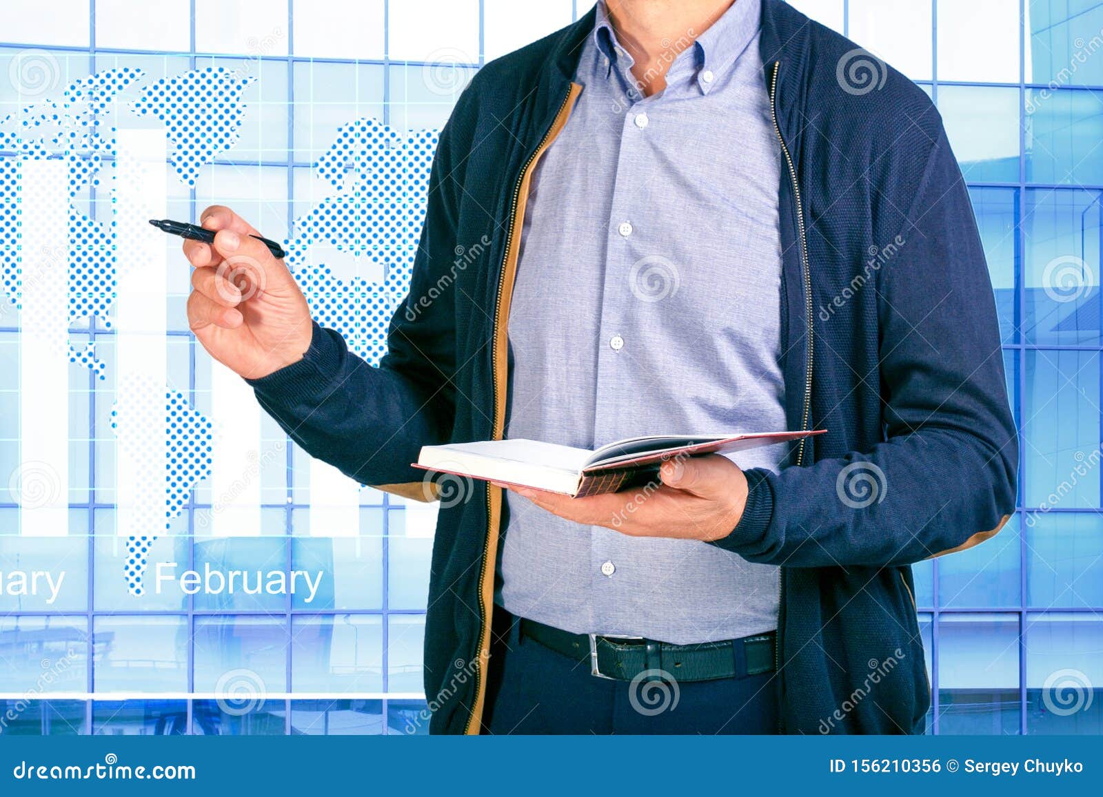 . Businessman Planning Business Schedule with Notepad and Modern ...
