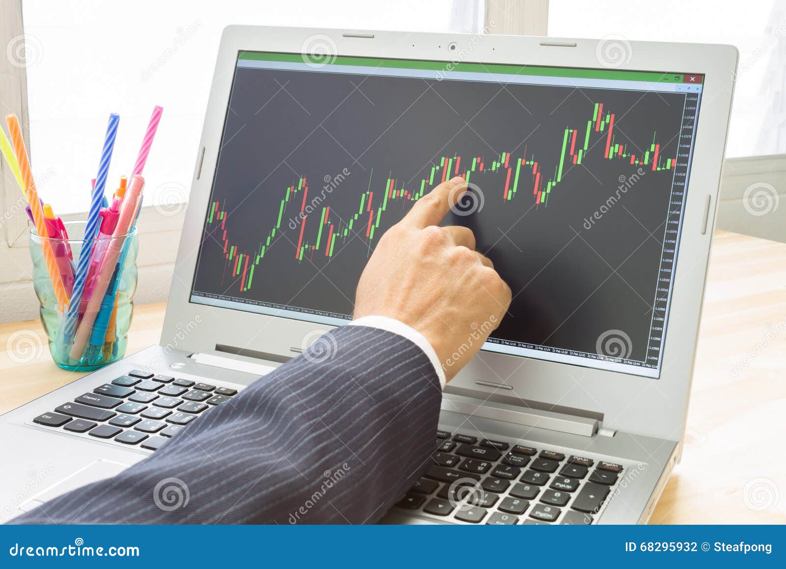 Businessman Point and Analyze Forex Graph or Stock Graph by Right ... Businessman Point and Analyze Forex Graph or Stock Graph by Right ...