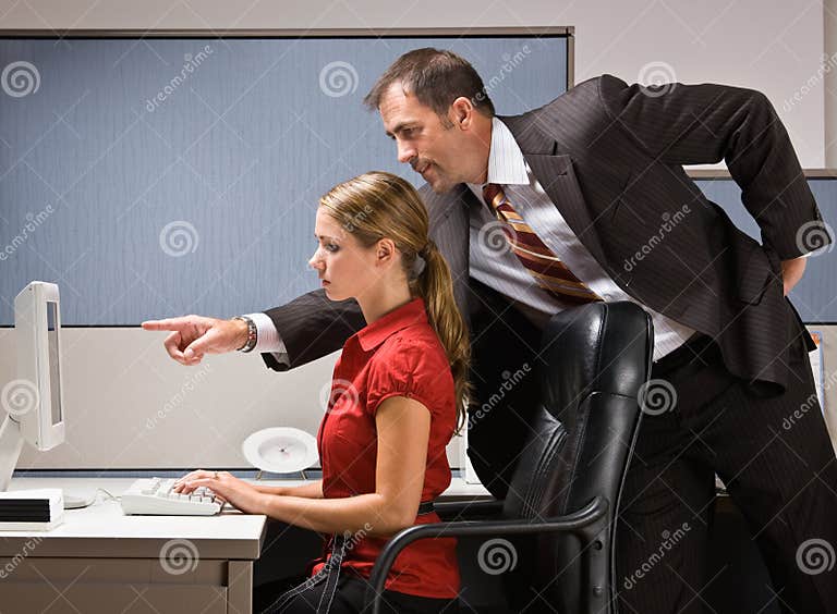 Businessman Pointing at Co-workers Computer Stock Image - Image of ...