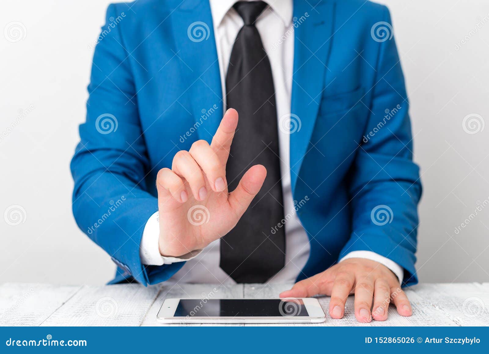 Businessman with Pointing Finger in Front of Him. Businessman Holds Lap ...