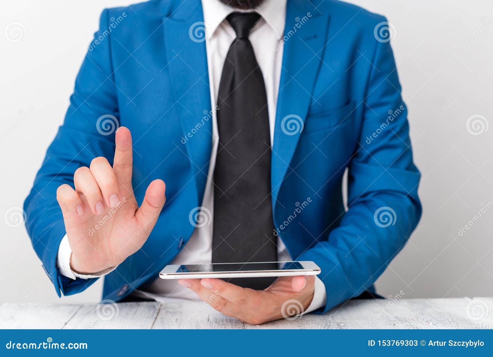 Businessman with Pointing Finger in Front of Him. Businessman Holds Lap ...
