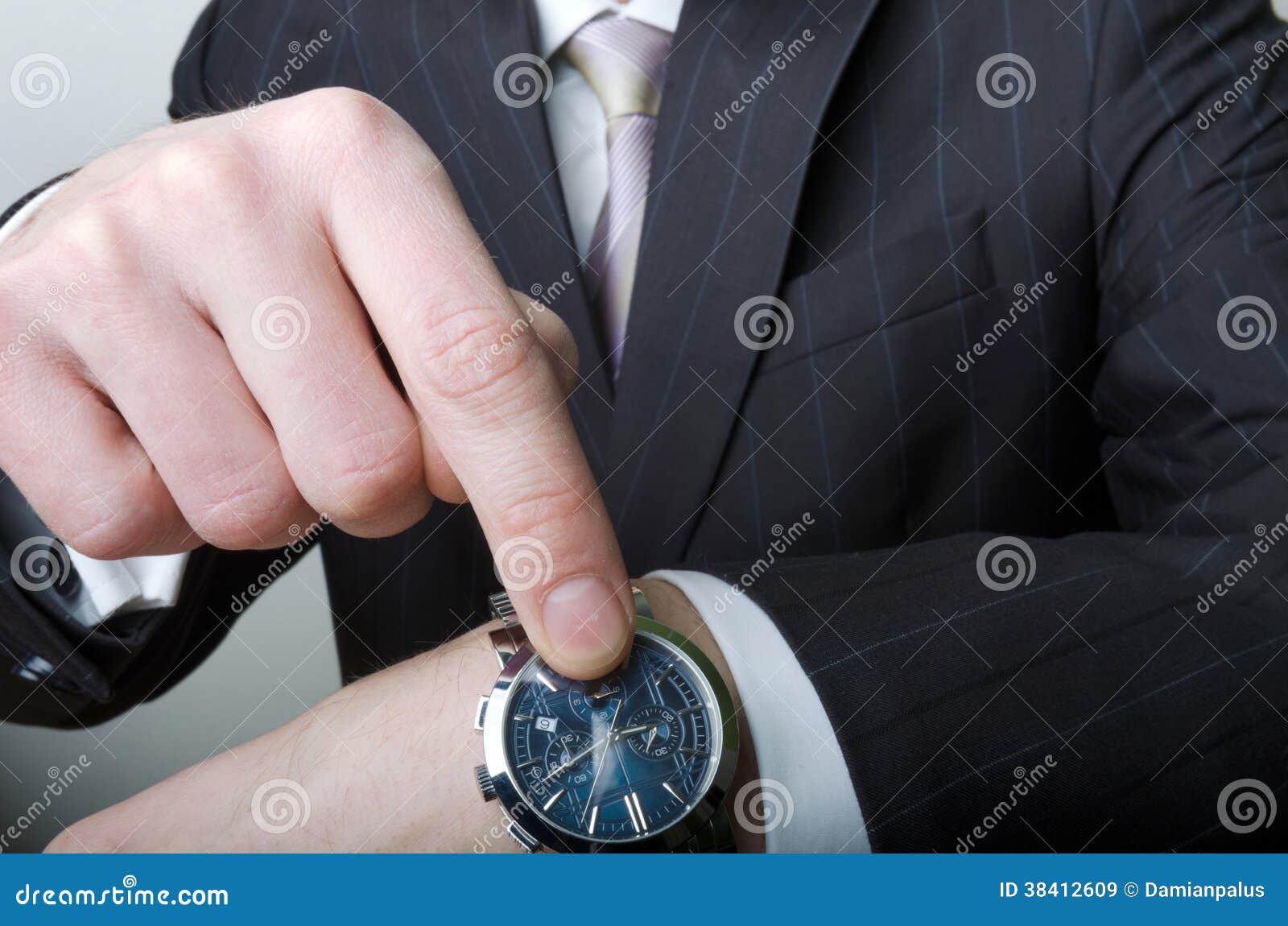 Businessman Pointing at His Watch Stock Image - Image of shot ...