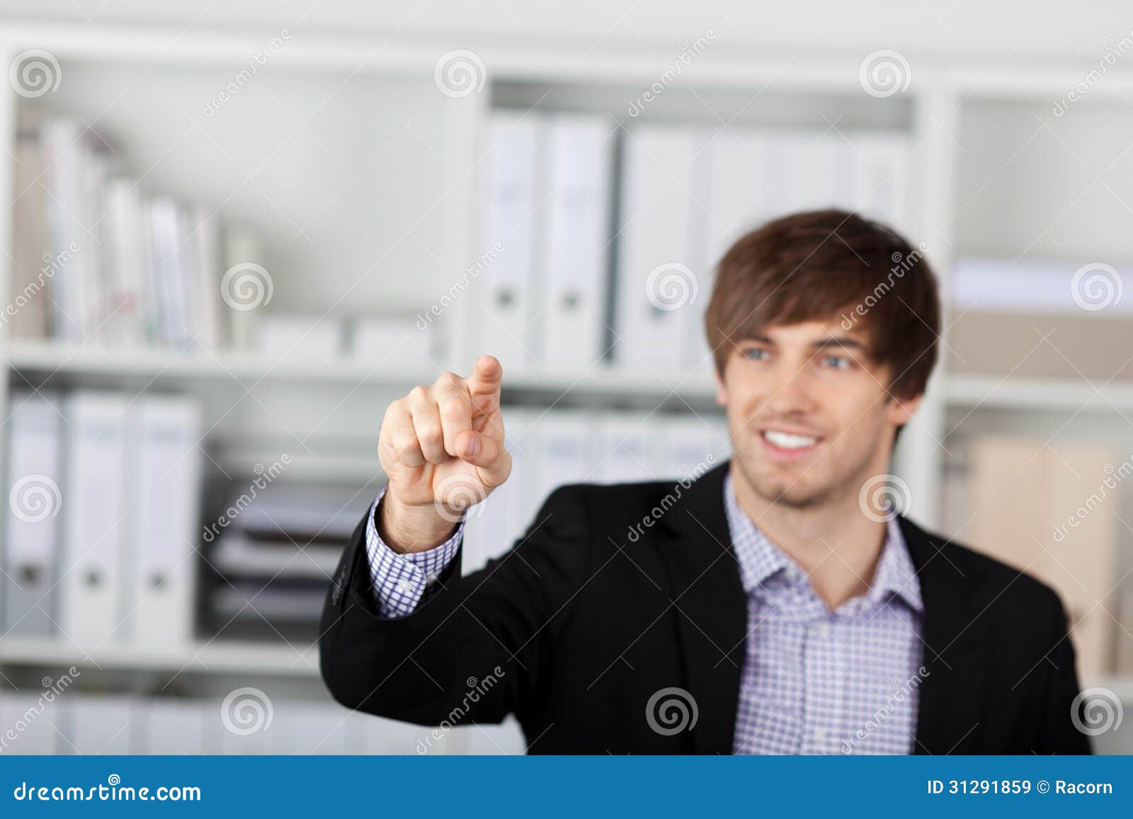 Businessman Pointing at Invisible Screen in Office Stock Image - Image ...