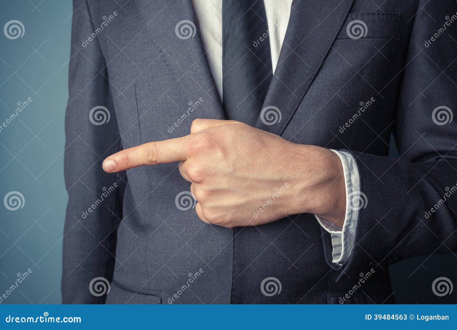 Businessman pointing left stock image. Image of young - 39484563