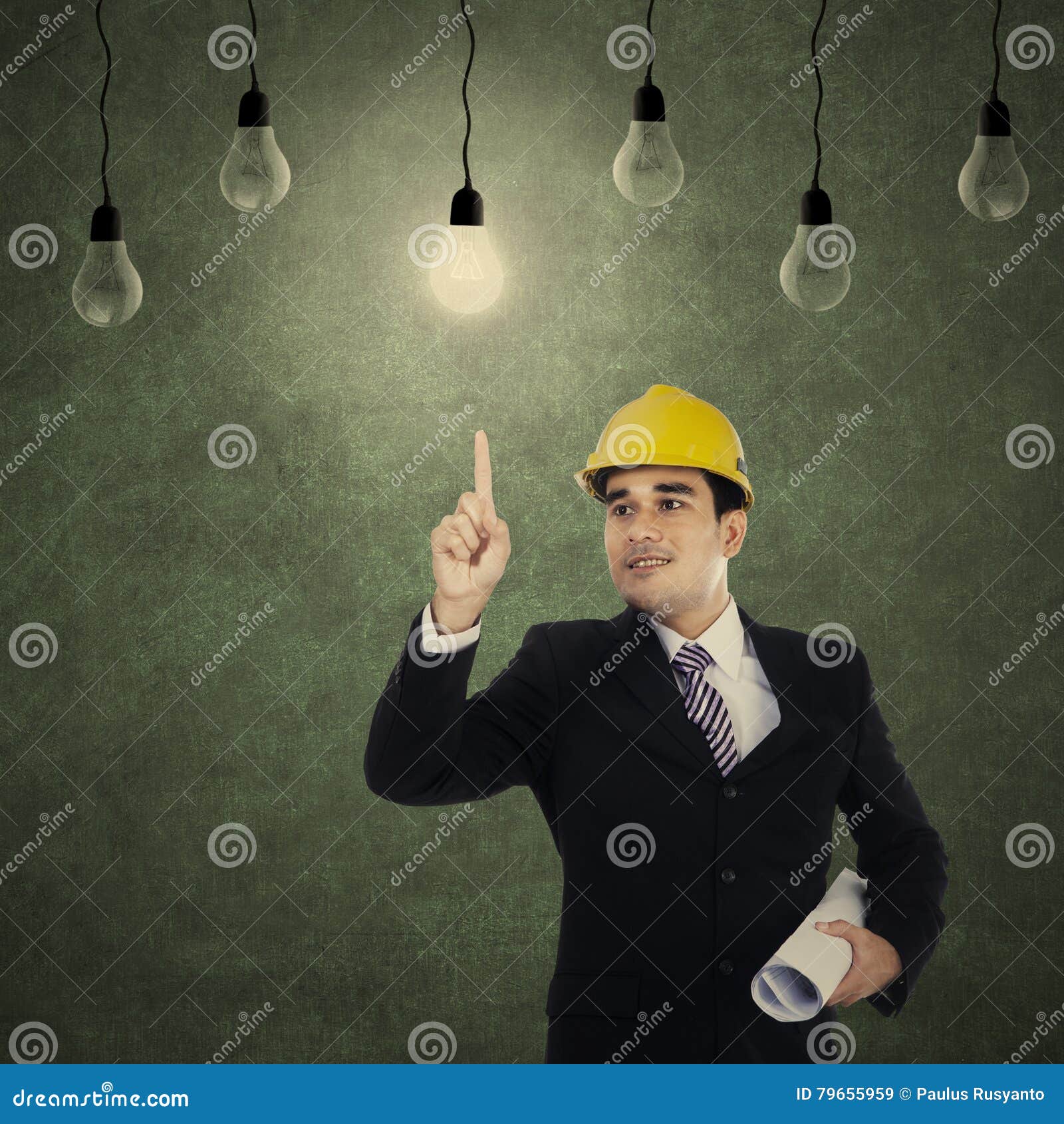 Businessman Pointing at Light Bulb Stock Image - Image of lamp ...