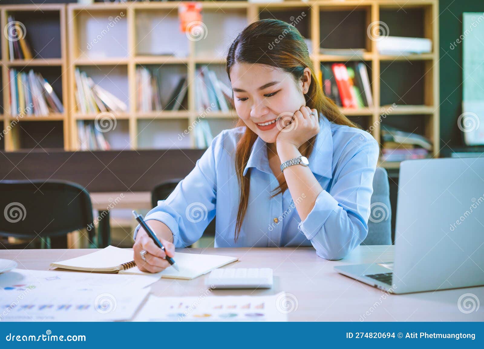 Businessman Pointing with Pen on Business Report Chart are Working on ...