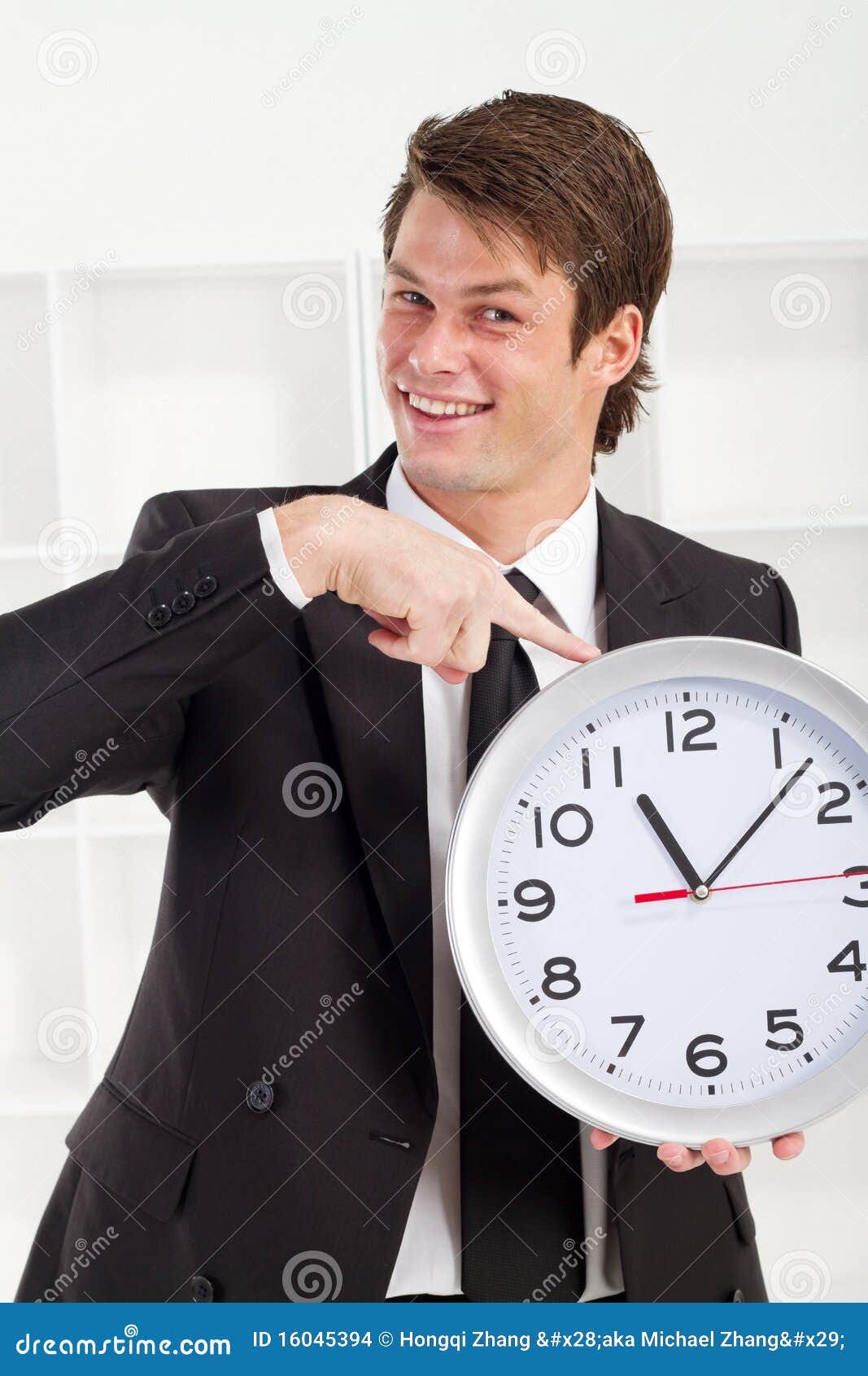 Businessman pointing time stock photo. Image of businessperson - 16045394