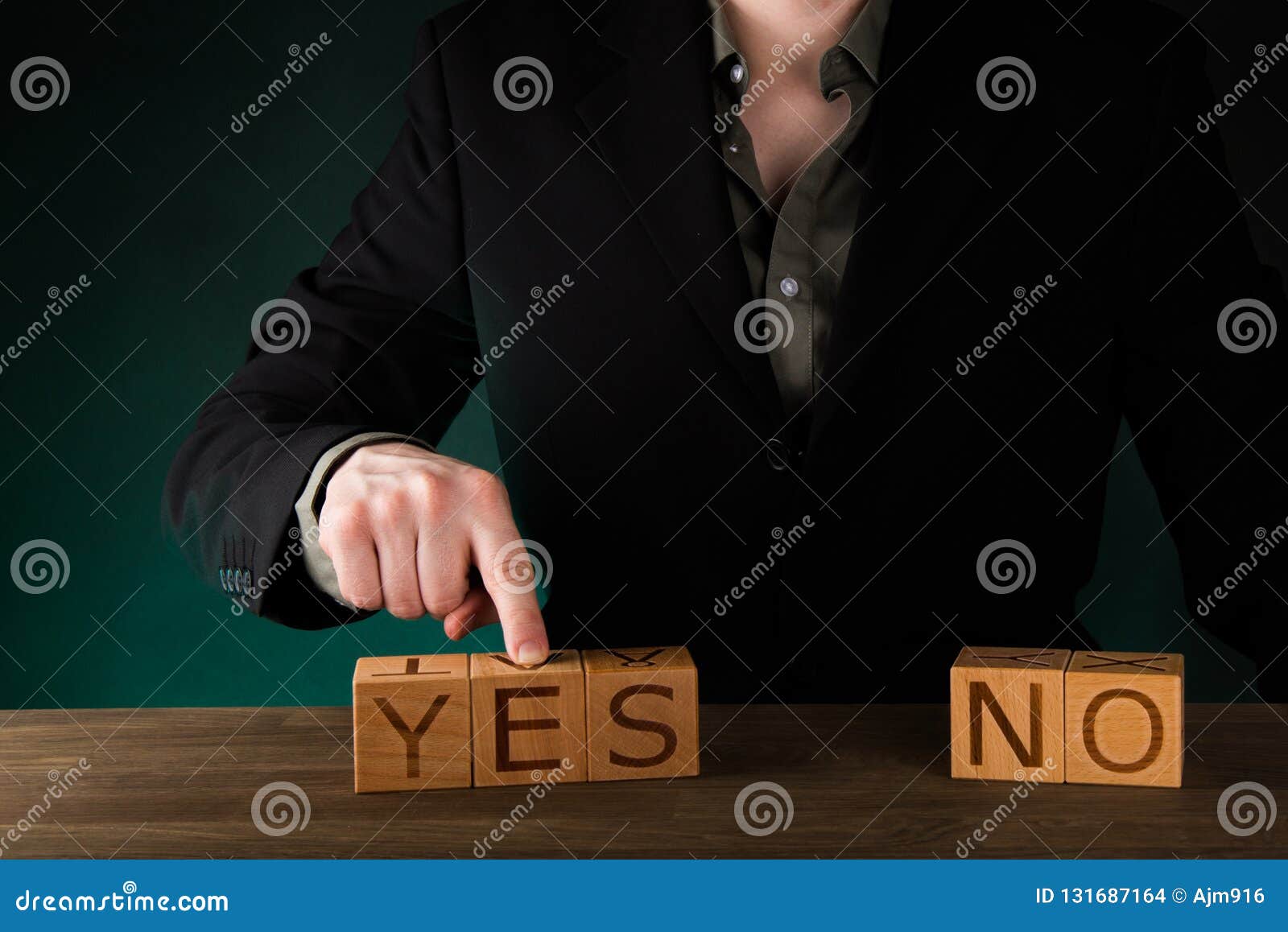 Businessman Pointing at Wood Cube Block with Word “YES†on Black ... Businessman Pointing at Wood Cube Block with Word “YES†on Black ...