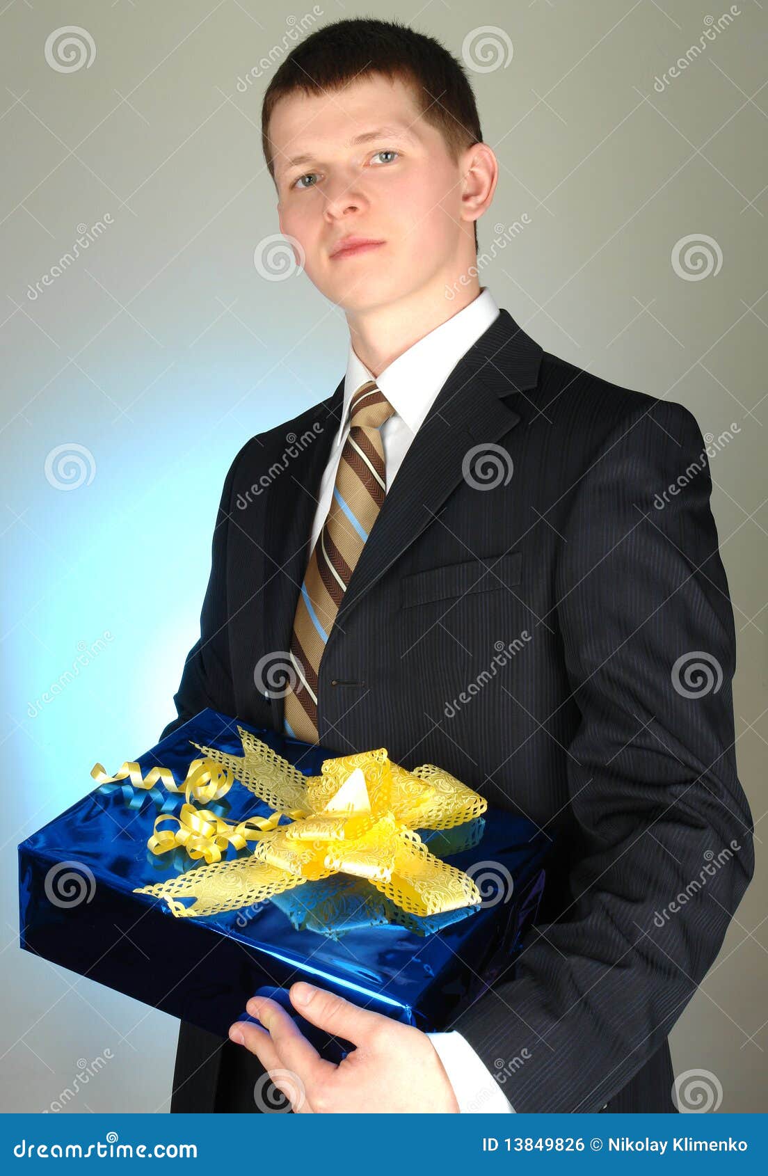 Businessman with present stock photo. Image of portrait - 13849826