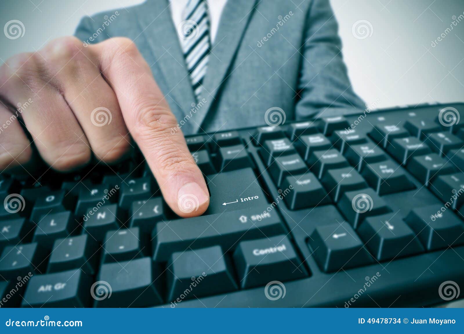 Businessman Pressing the Intro Key of a Computer Keyboard Stock Photo ...
