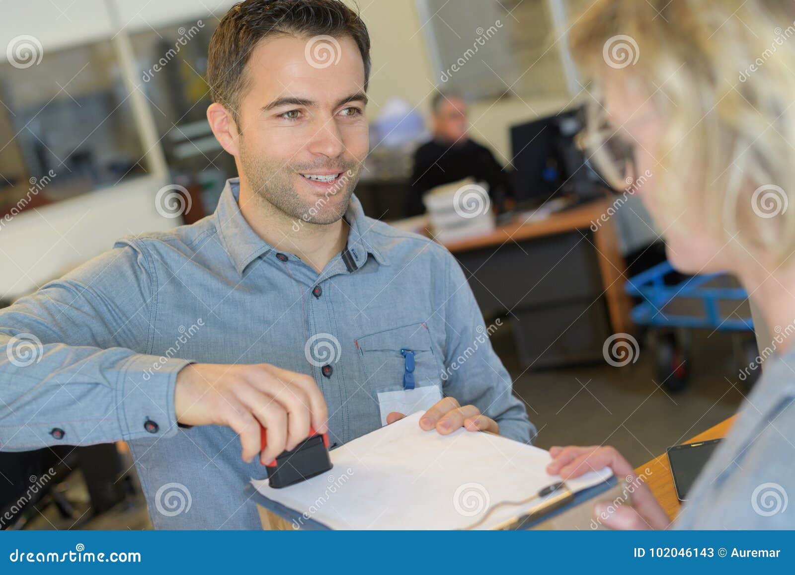 Businessman Pressing Stamp on Document in Office Stock Image - Image of ...
