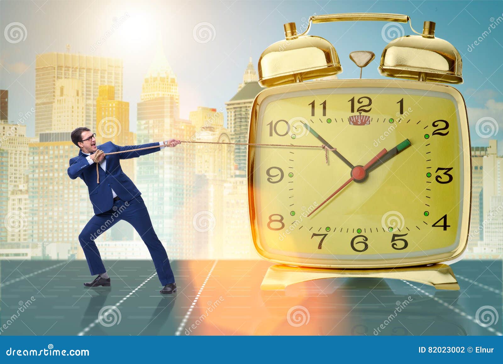 The Businessman Pulling Clock in Time Management Concept Stock Photo ...