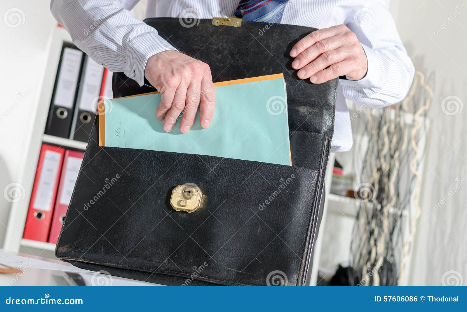Businessman Pulling Out Folders from His Briefcase Stock Photo - Image ...
