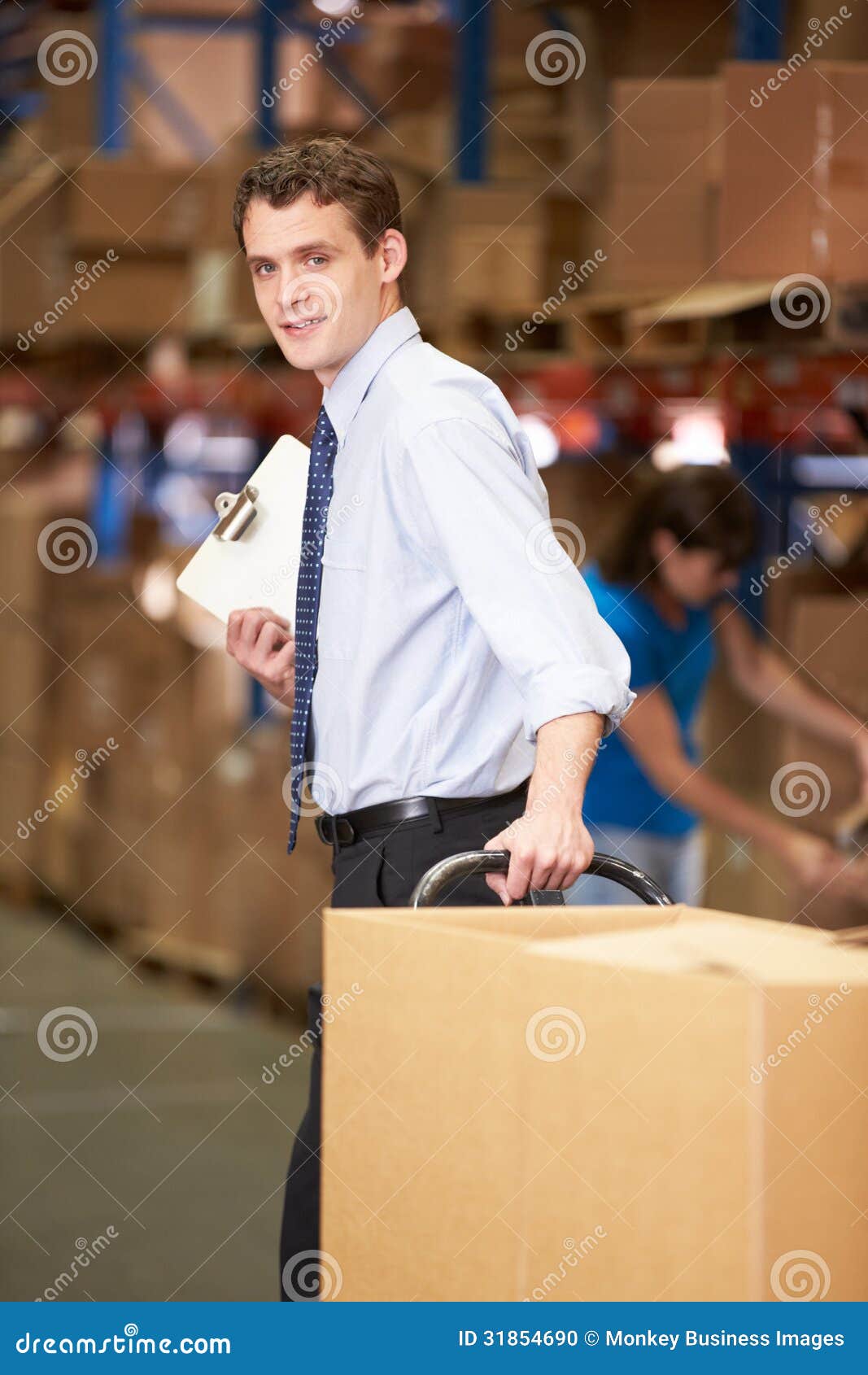 Businessman Pulling Pallet in Warehouse Stock Photo - Image of ...