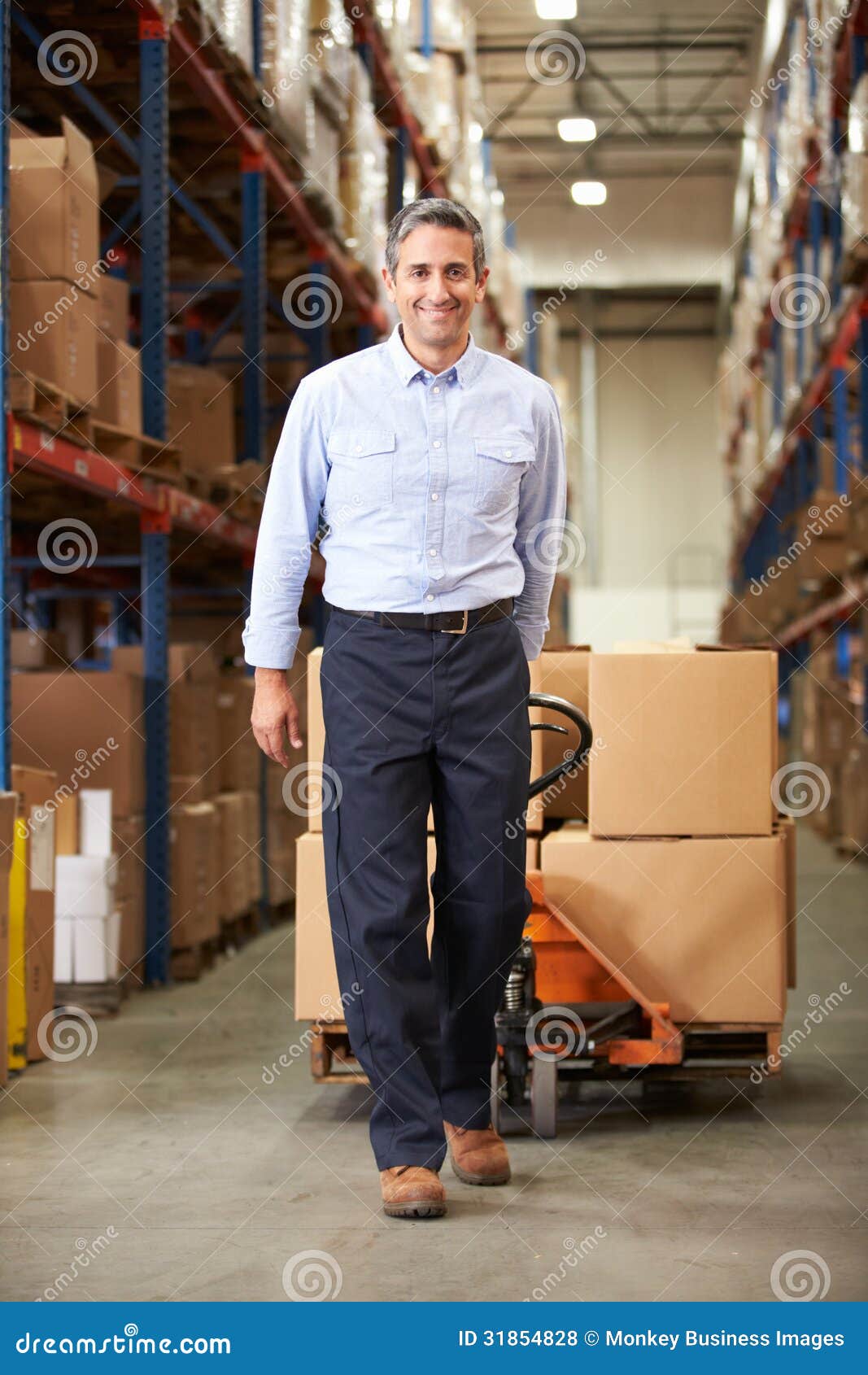 Businessman Pulling Pallet in Warehouse Stock Photo - Image of shelves ...