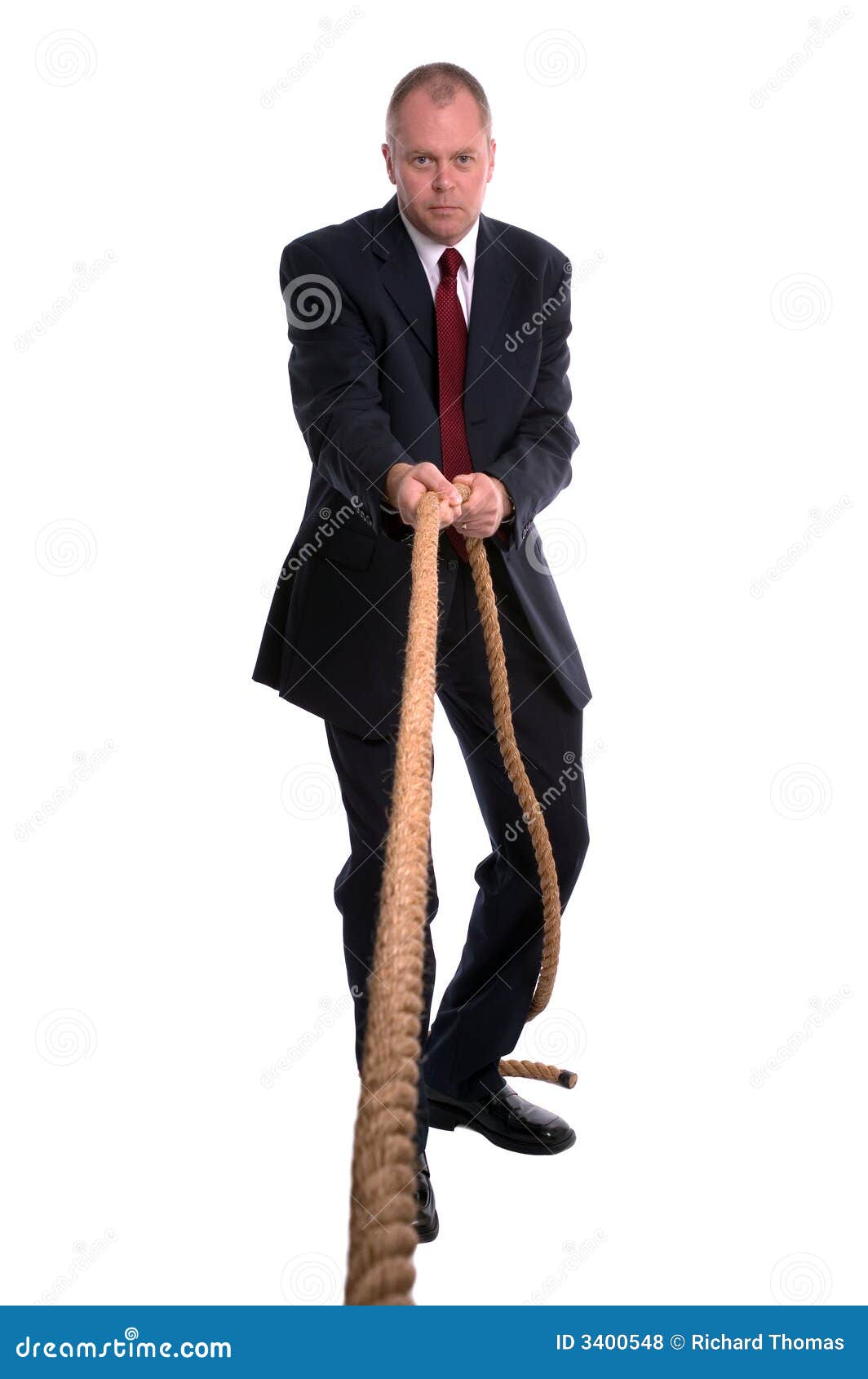 Businessman pulling rope. stock photo. Image of control - 3400548
