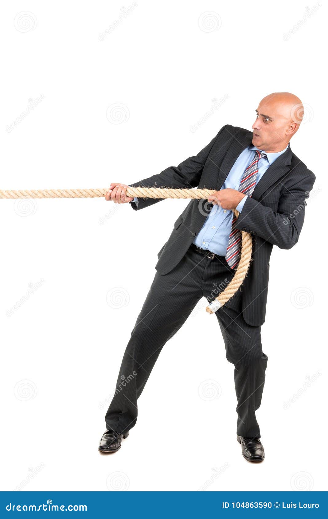 Businessman pulling a rope stock photo. Image of cool - 104863590