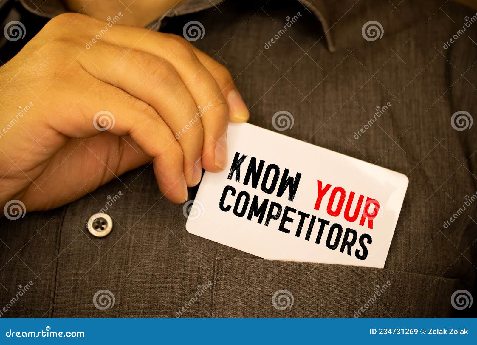 Businessman Putting a Card with Text Know Your Competitors in the ...