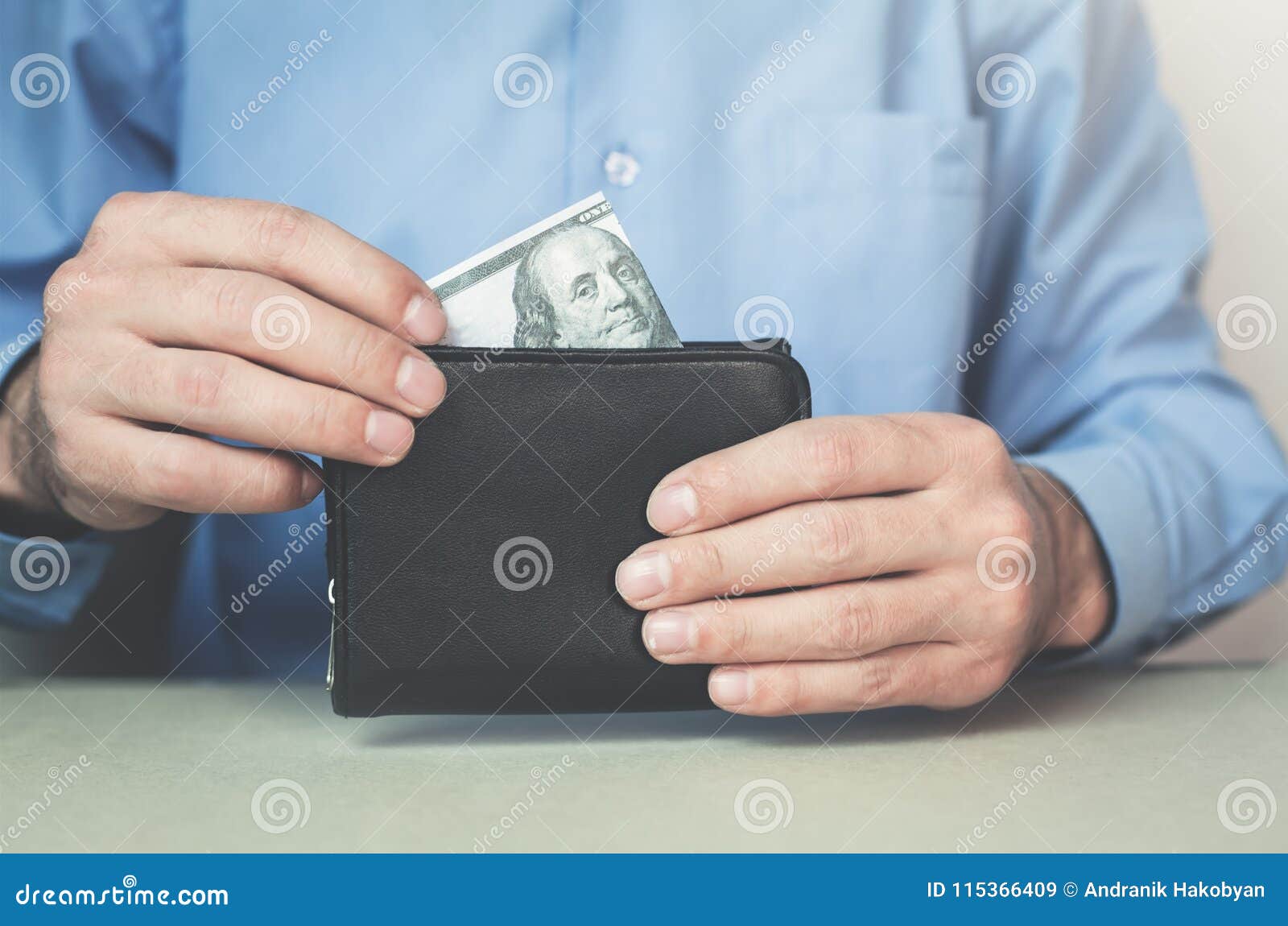 Businessman Putting Money into Wallet. Stock Image - Image of office ...