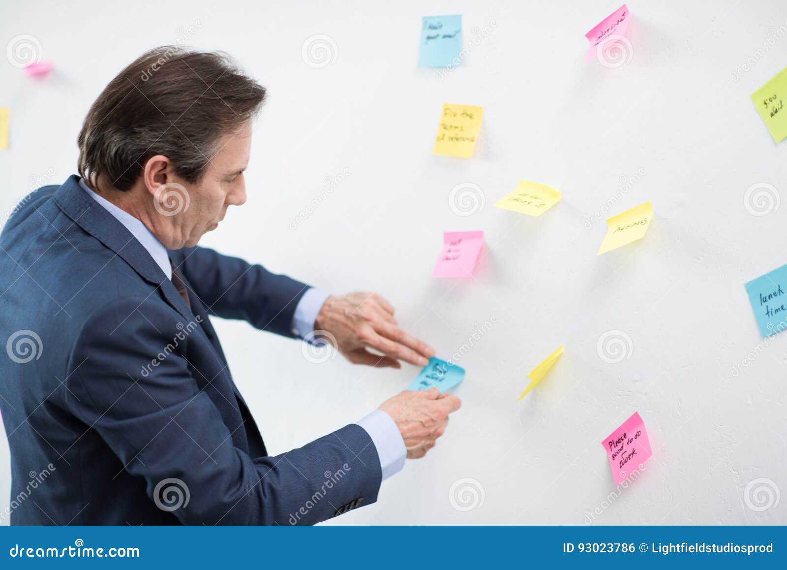 Businessman Putting Sticker on Board Stock Photo - Image of european ...