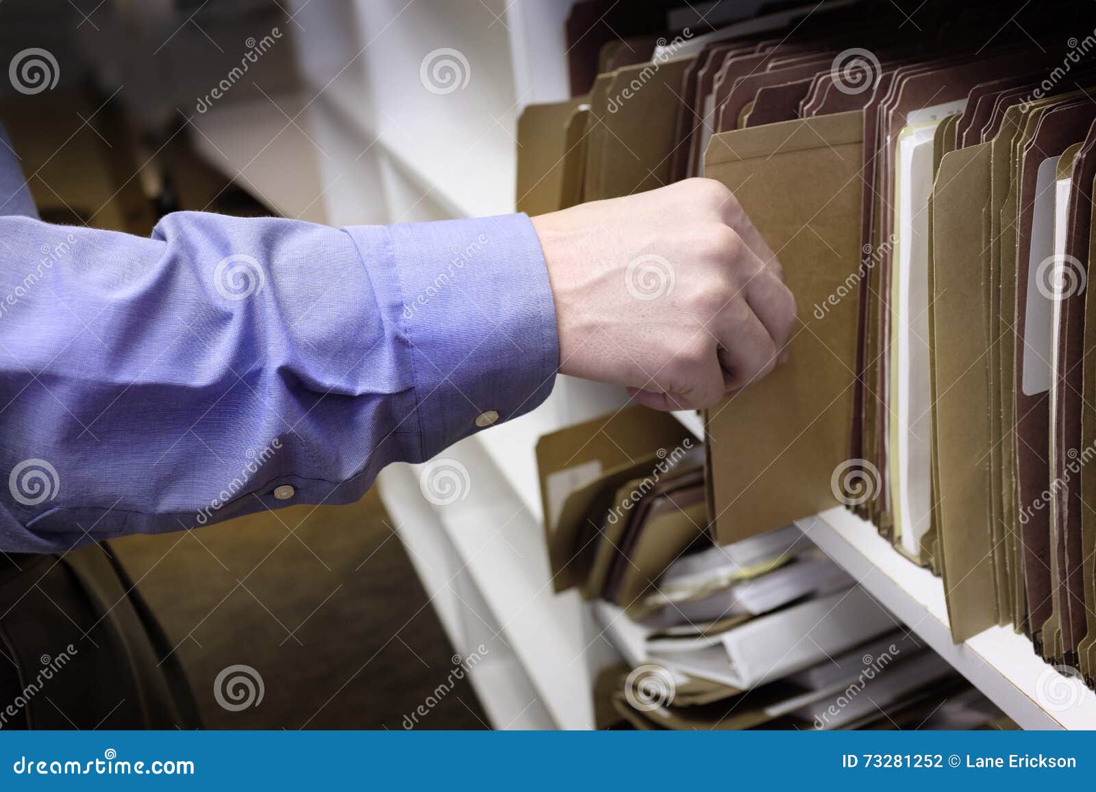 Businessman Reaching Hand for Files on Shelf Stock Photo - Image of ...