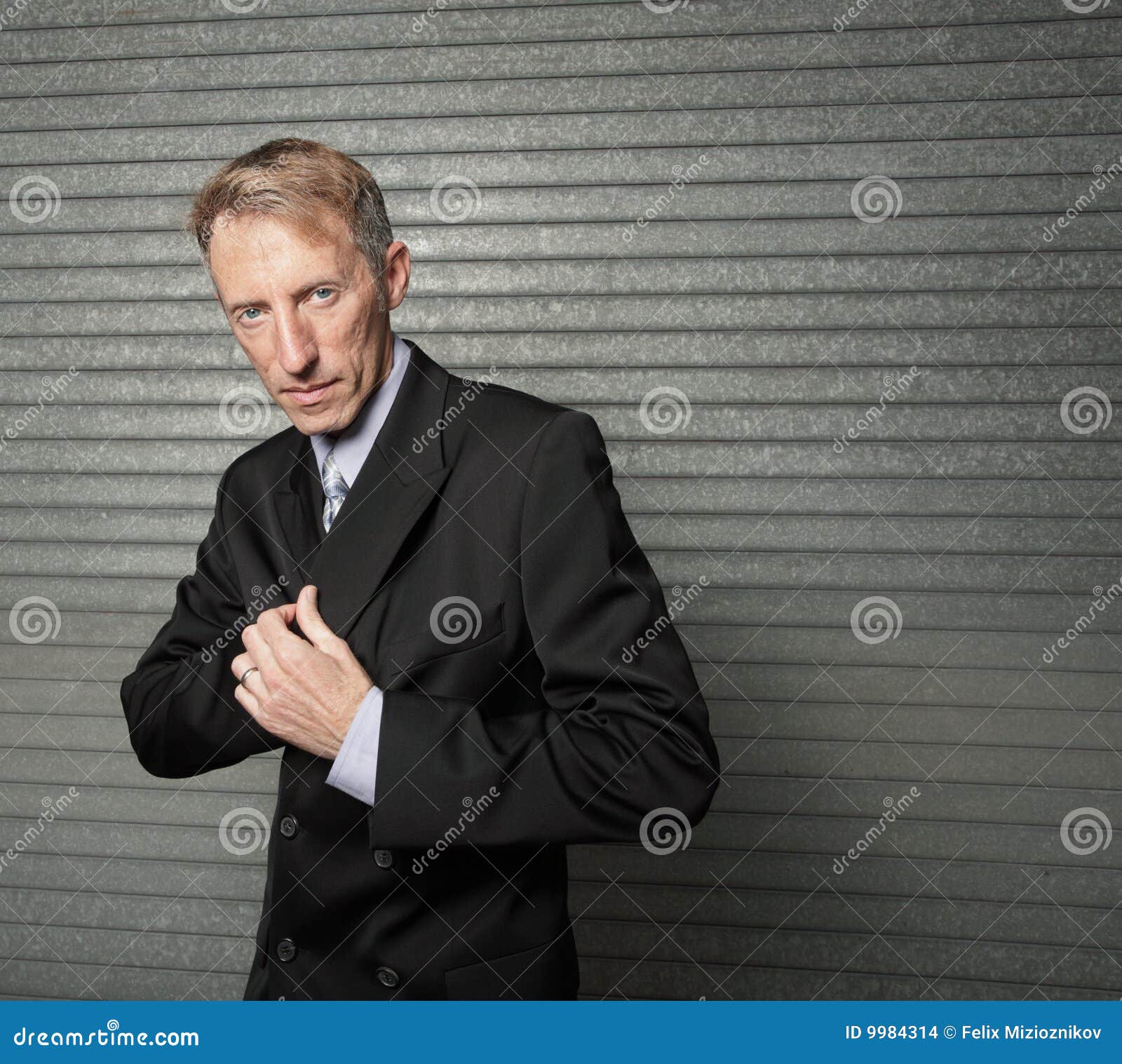 Businessman Reaching in His Jacket Stock Photo - Image of reaching ...