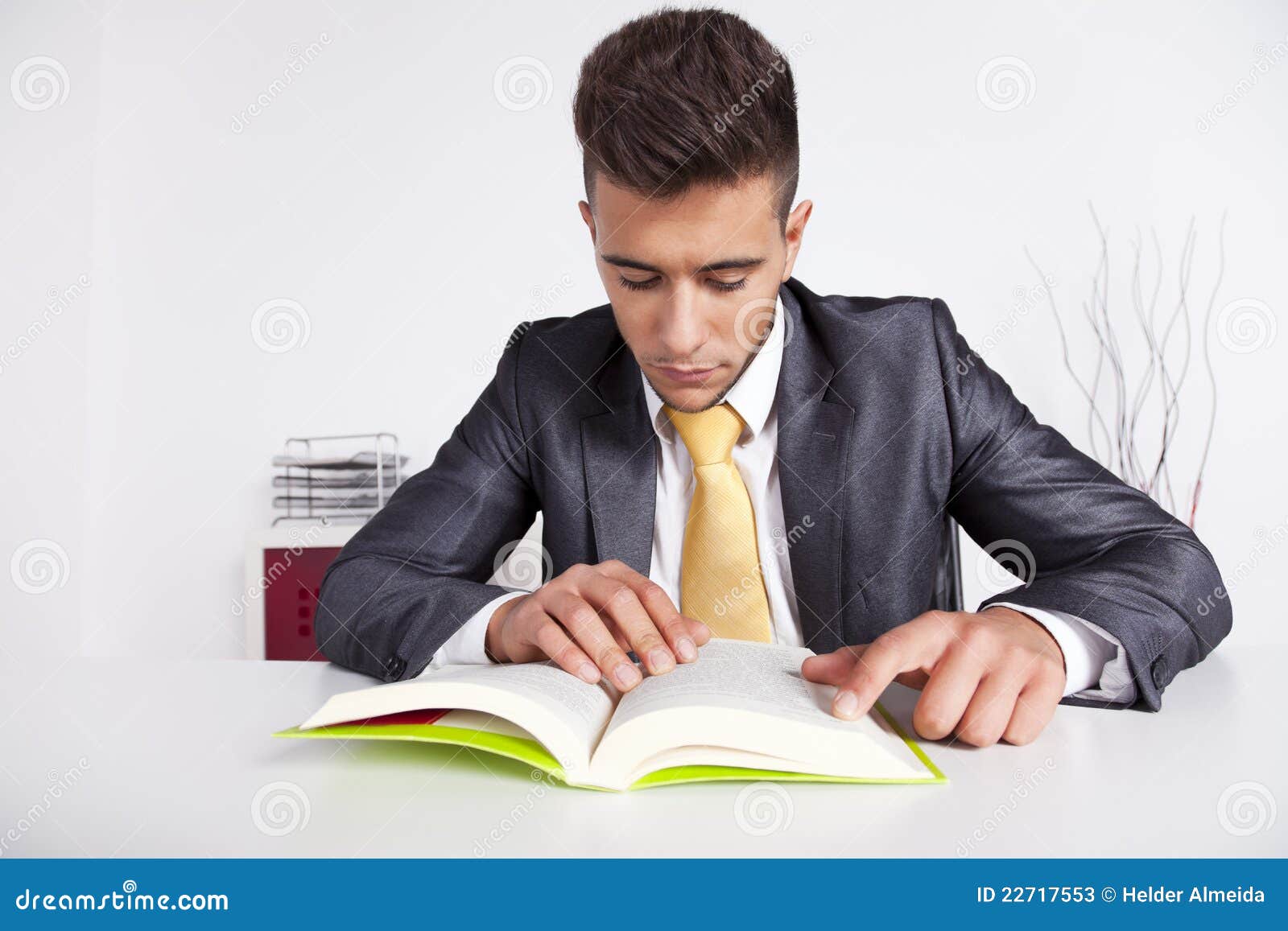 Businessman reading a book stock image. Image of person - 22717553