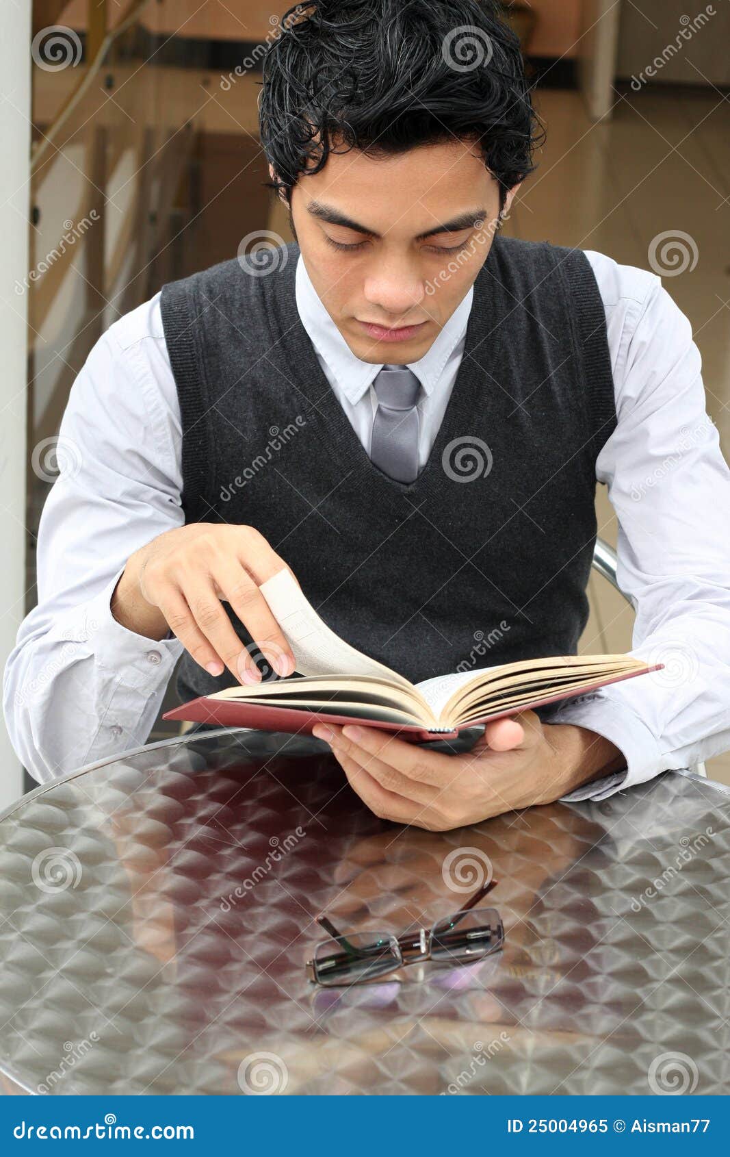 Businessman reading a book stock image. Image of education - 25004965