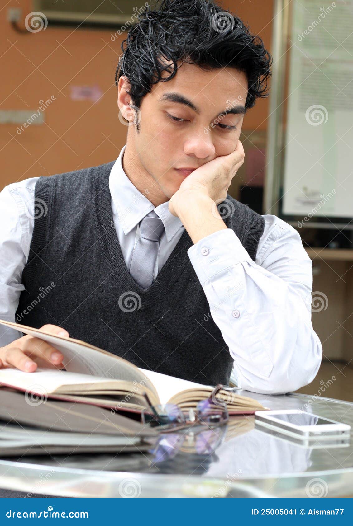 Businessman reading a book stock image. Image of expression - 25005041
