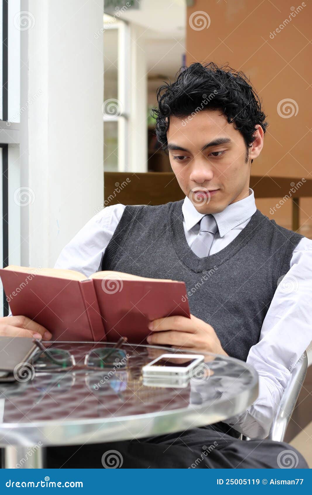 Businessman reading a book stock image. Image of handsome - 25005119