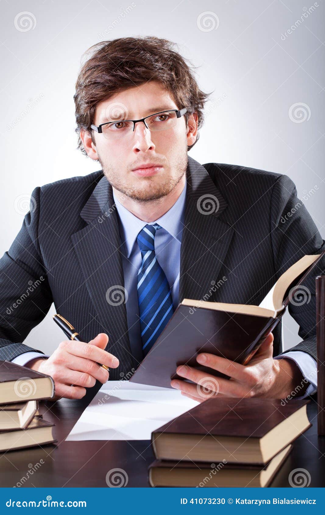Businessman Reading a Book and Writing Stock Photo - Image of assistant ...