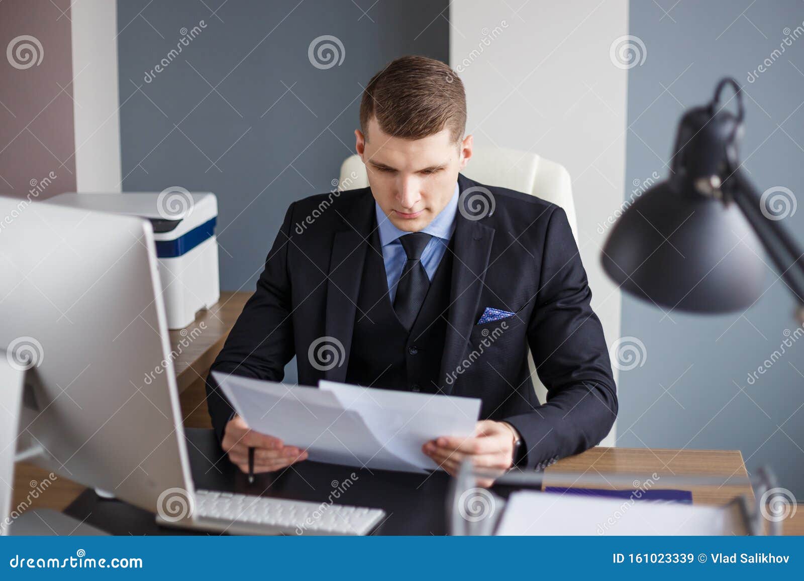 Businessman Reading Contract in Office Stock Image - Image of paperwork ...