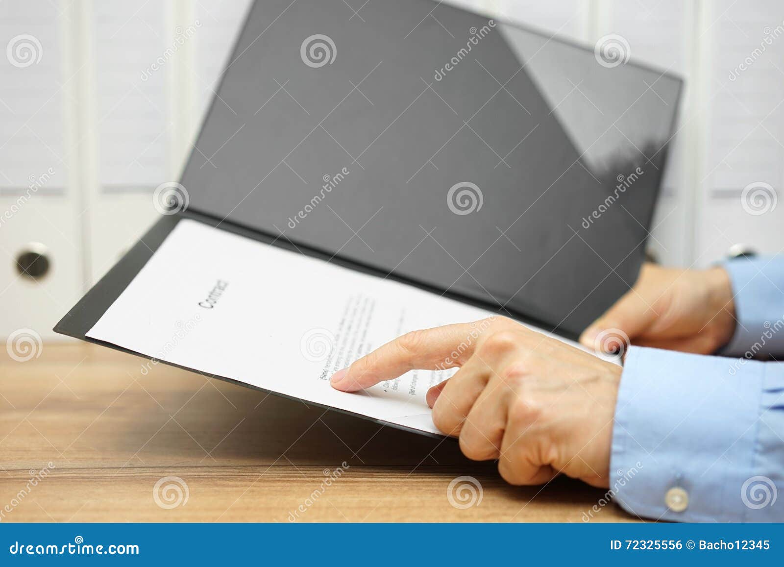 Businessman is Reading Contract in Office at the Desk Stock Photo ... Businessman is Reading Contract in Office at the Desk Stock Photo ...